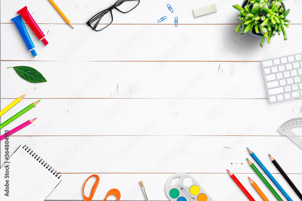School supplies on white wooden desk. Top view, flat lay composition ...