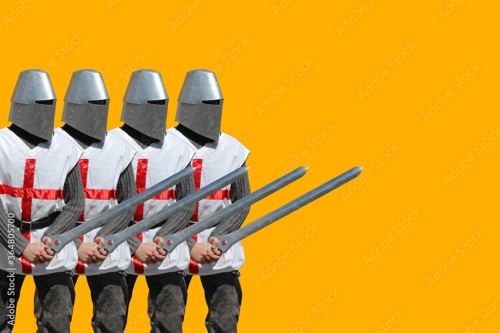 Four armed knights in the helmet and with the sword are ready for ...