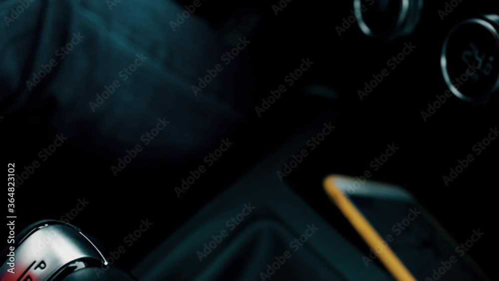 Man switches car automatic shift knob to drive. Starting a road trip ...