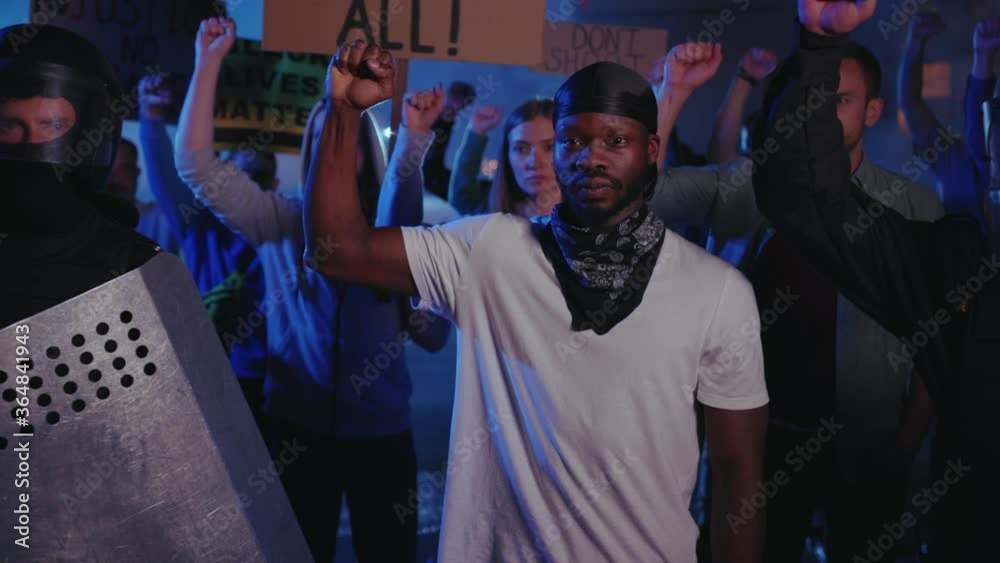 Strong positive crowd of multi-ethnic young activists protest for human ...