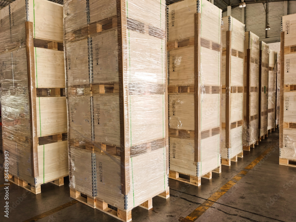 Shipment cartons box on pallets and wooden case on forklift in interior ...