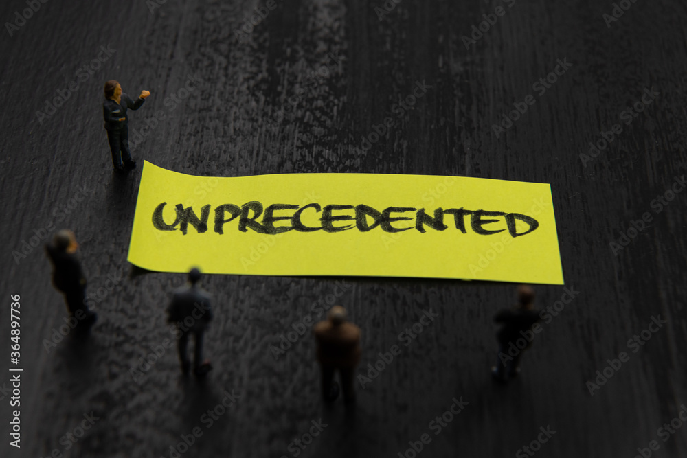 Strategy meeting with miniature figurines posed as business people ...