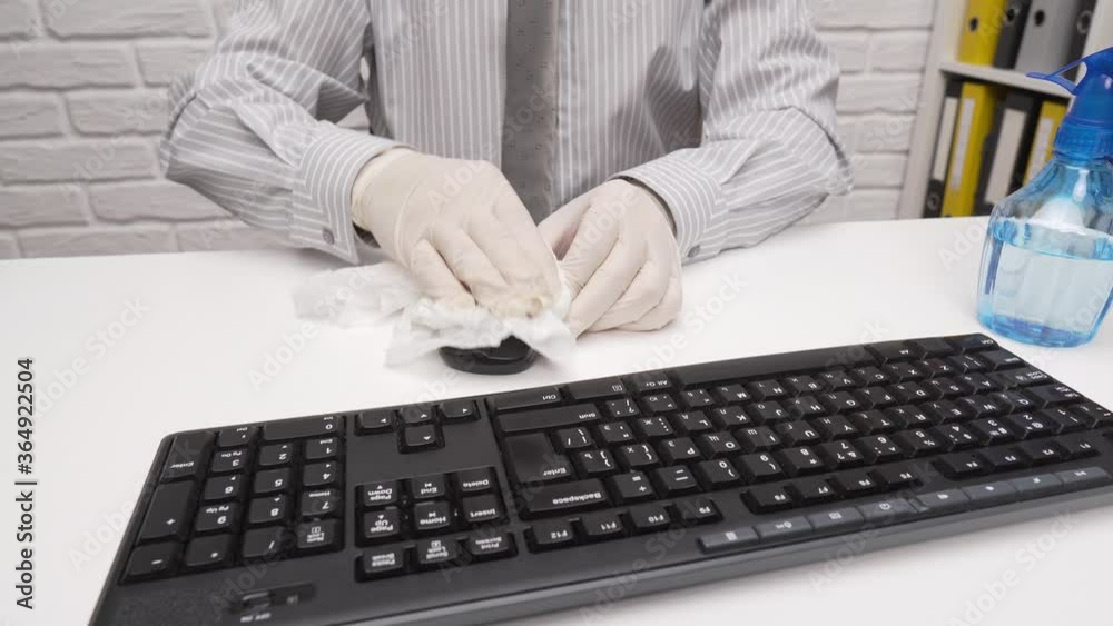 concept of cleaning or disinfecting the office desk - a businessman ...