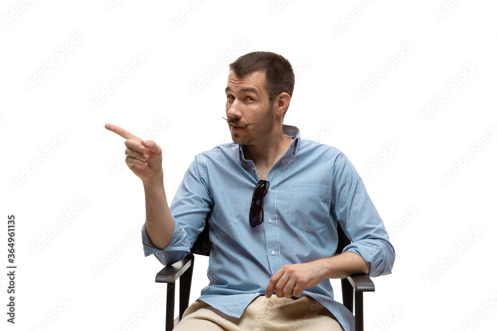 Pointing. Young caucasian man with funny, unusual popular emotions and ...