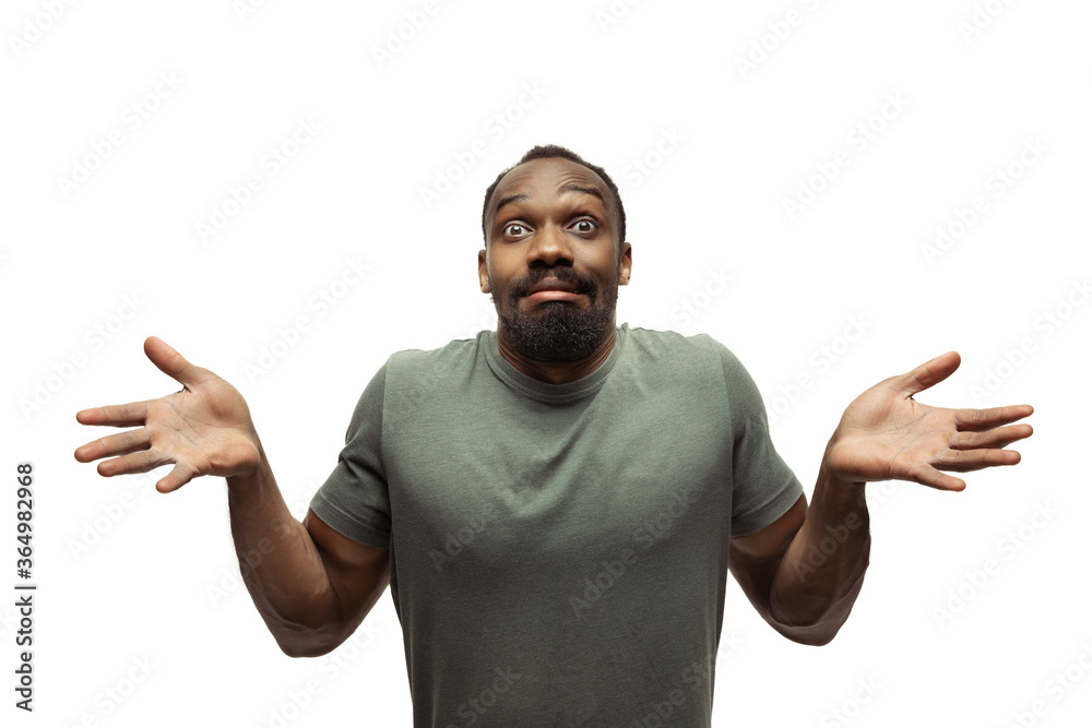 Oops. Young african-american man with funny, unusual popular emotions and gestures on white ...