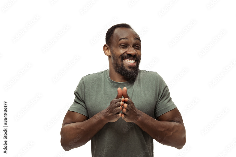 Gloating. Young african-american man with funny, unusual popular ...