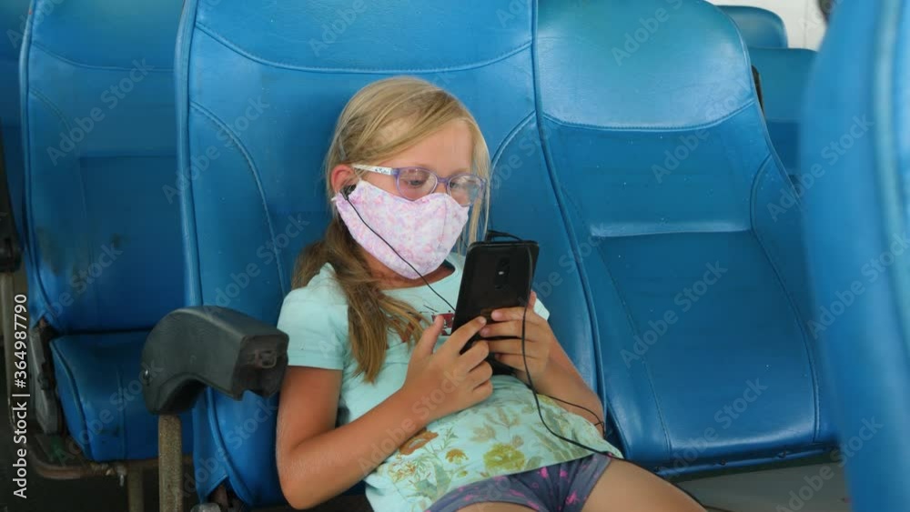 People on boat with social distancing seat. Child girl in protective ...