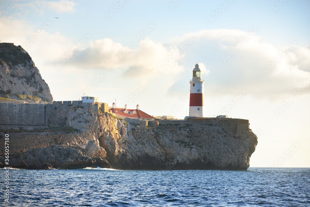 Trinity lighthouse at the rocky shore (cliffs) of the Europa Point ...