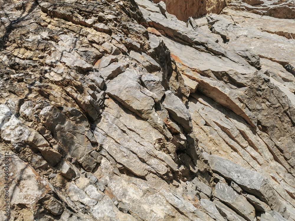 Mountain mineral rock shale with a parallel layered arrangement of ...
