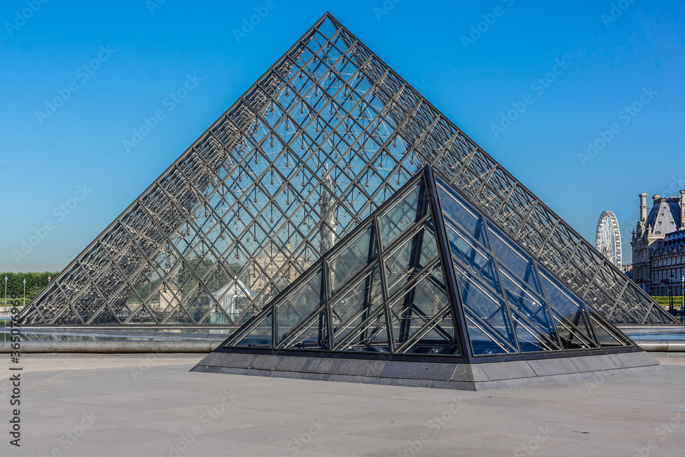 View of Louvre pyramid at courtyard of Louvre Museum. Louvre Museum is ...