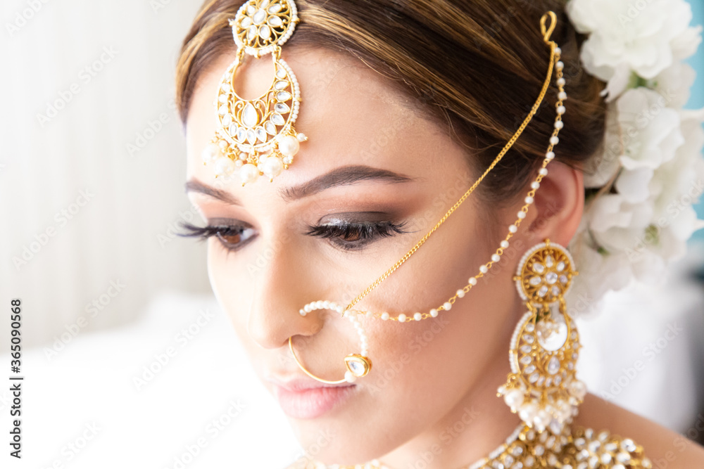 Beautiful female model wearing traditional Sikh wedding attire as she ...
