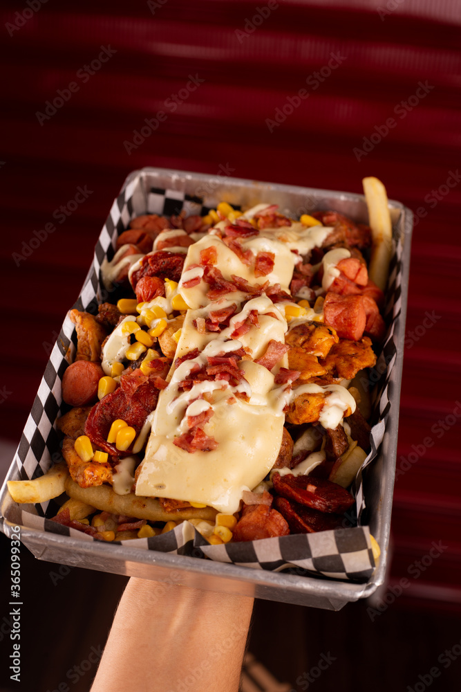 delicious crazy potatoes from colombia. french fries, sausage, meat ...