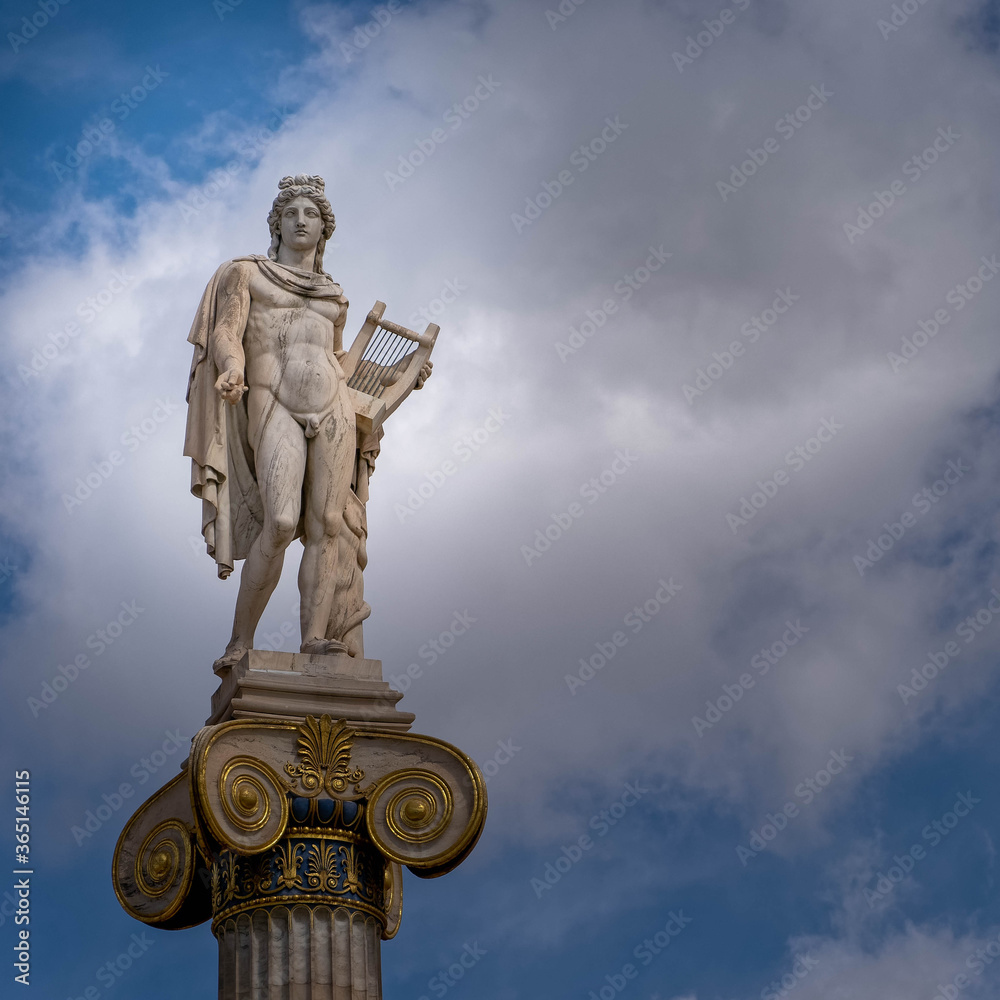 Apollo, the ancient Greek god of arts under impressive sky, Athens ...