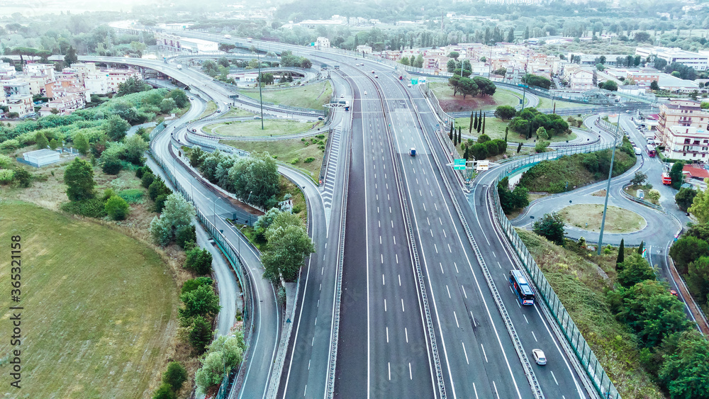 Aerial view of highway in city. Cars crossing interchange overpass ...