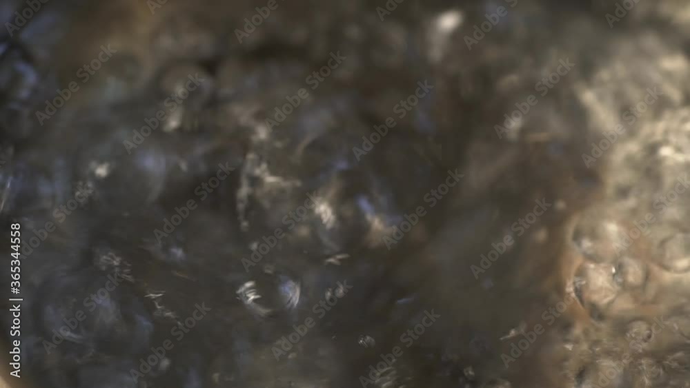 Water boiling,Close-up in pot of boiling water,Bubbles of boiling water ...