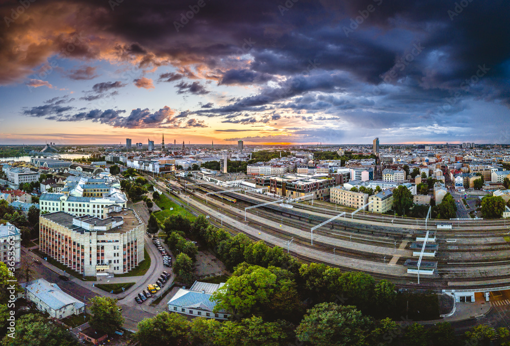 Aerial view of iconic Riga city in dramatic sunset. Modern architecture ...