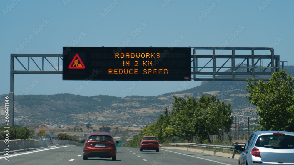 Road sign in Greek highway with message on electronic display ...