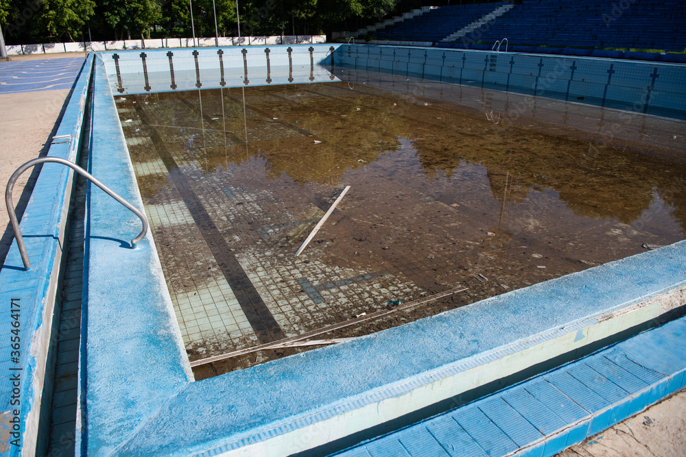 Damaged swimming pool. Old swimming pool with dirty water Stock Photo ...