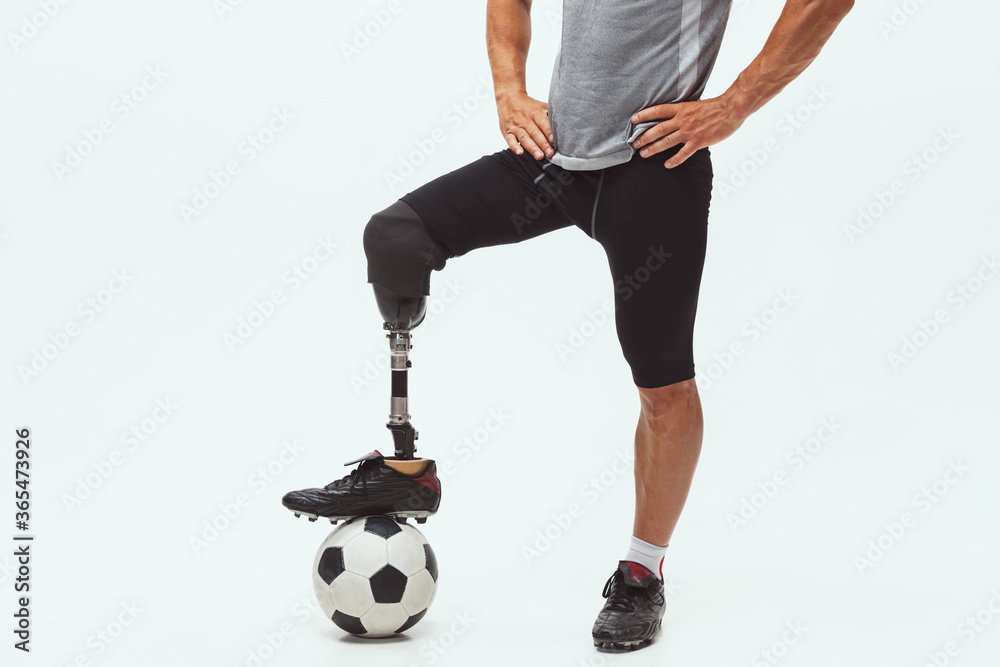 Athlete with disabilities or amputee on white studio background ...