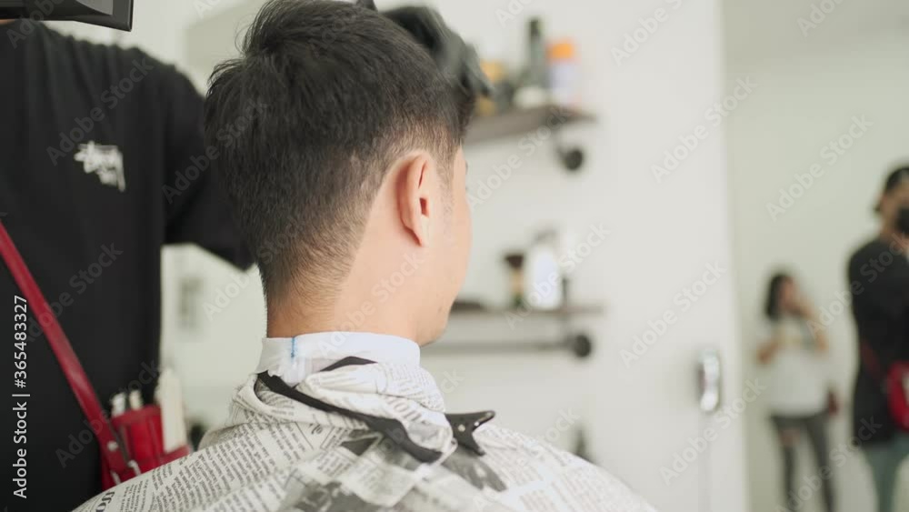 Clean white theme Asian barber shop, man get hair cut. well grooming ...