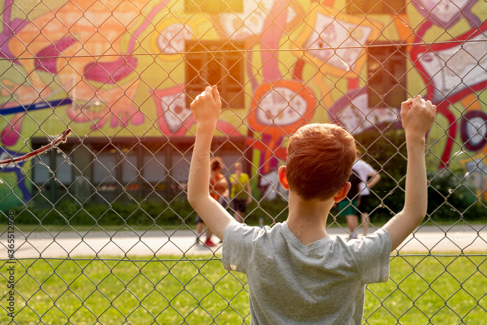 Sad boy can not play with other childs, mobbing Stock Photo | Adobe Stock