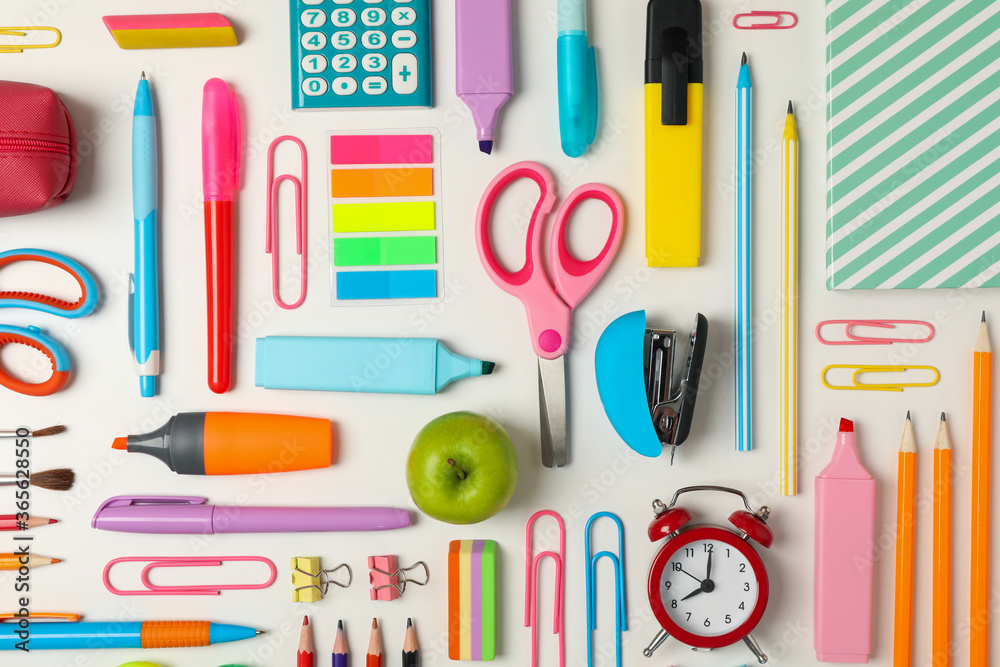 Flat lay with different school supplies on white background Stock Photo ...