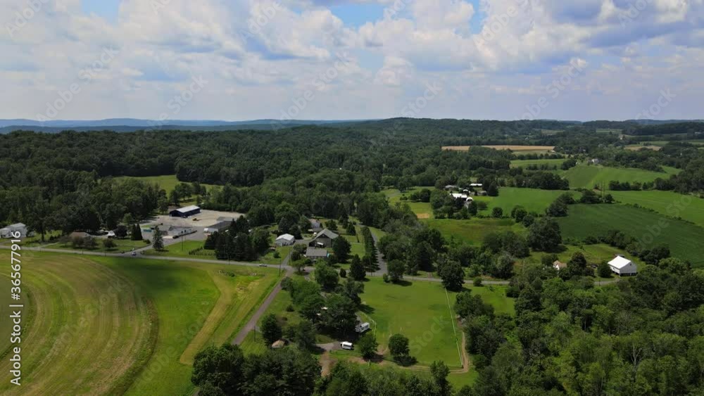 Aerial drone of forests and farm fields village in the mountains Pocono ...