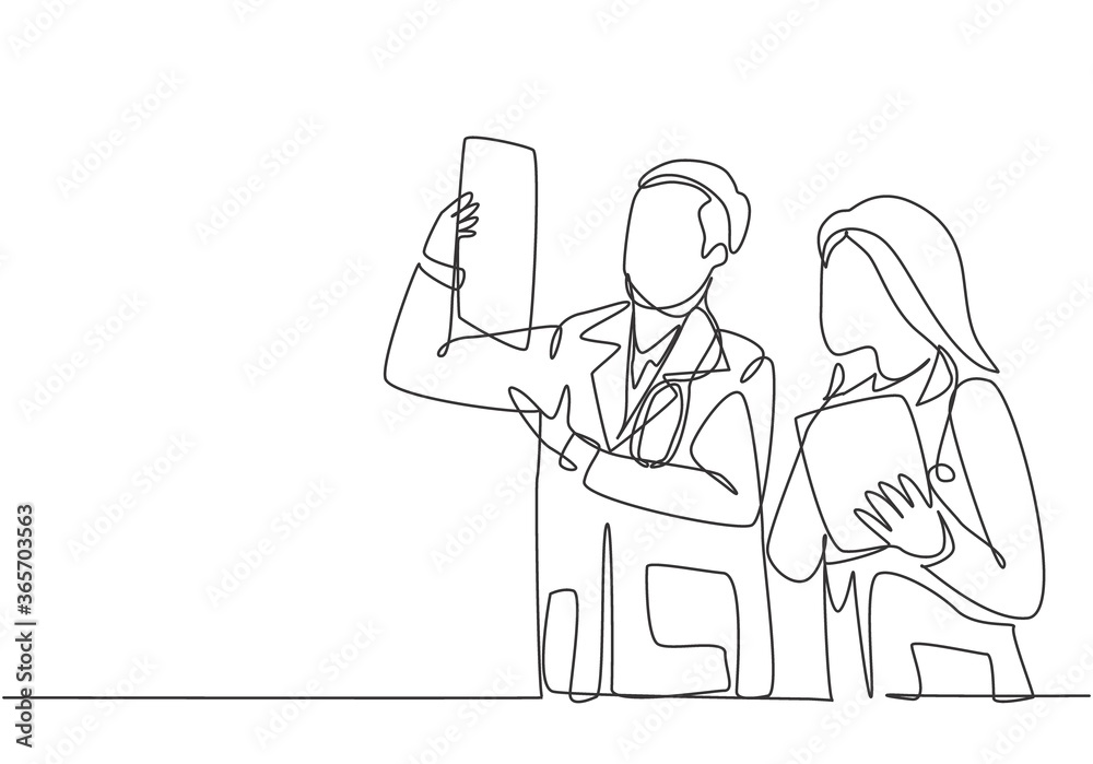 One continuous single line drawing of young male and female doctor ...