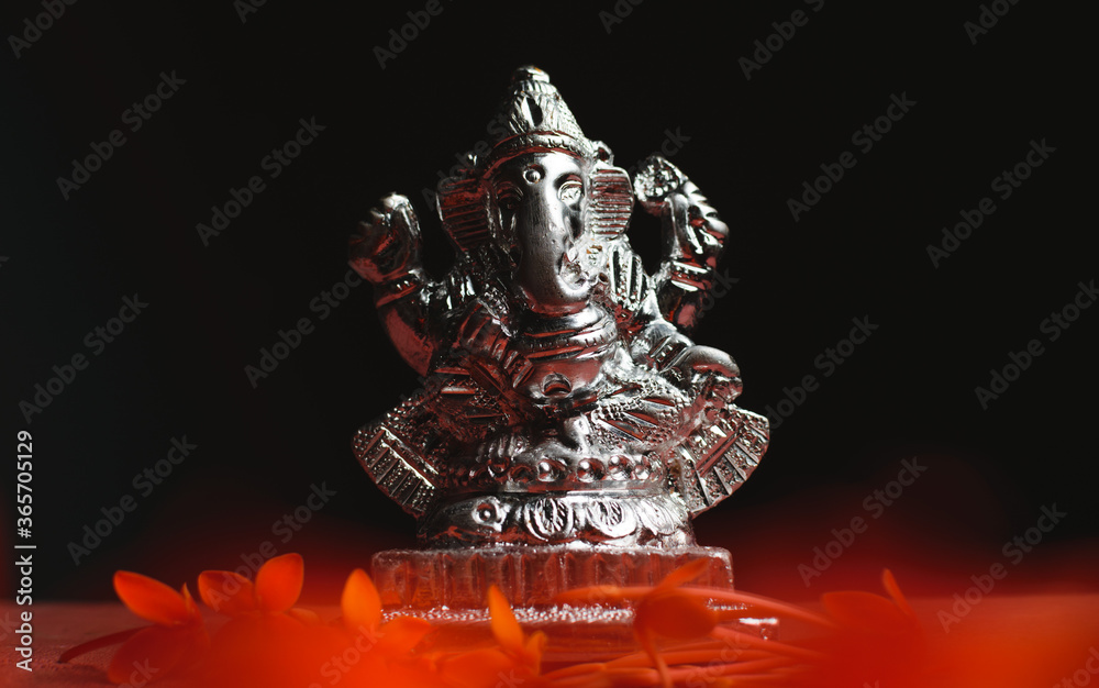 Ganesha / Ganapathi idol decorated with flowers and interesting ...