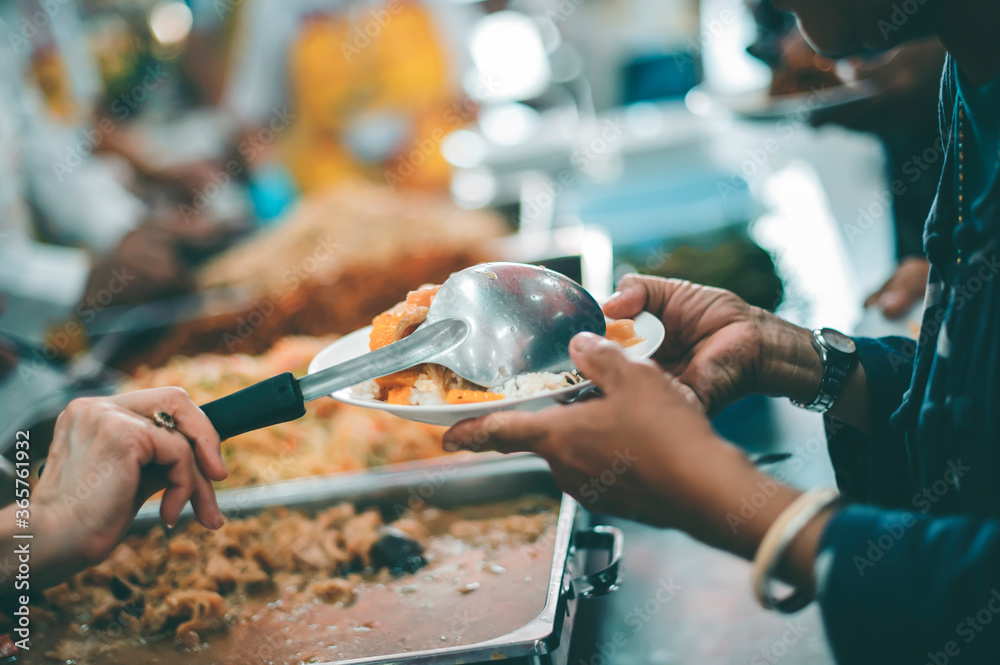 concepts of poverty : Volunteers Share Food to the Poor to Relieve ...