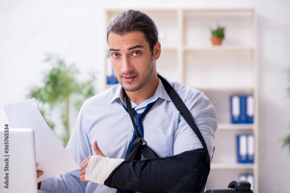 Injured male employee at workplace after accident Stock Photo | Adobe Stock