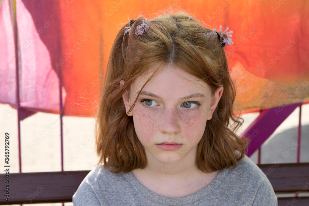 Stockfoto A beautiful teenage girl with ponytails and freckles flushed ...