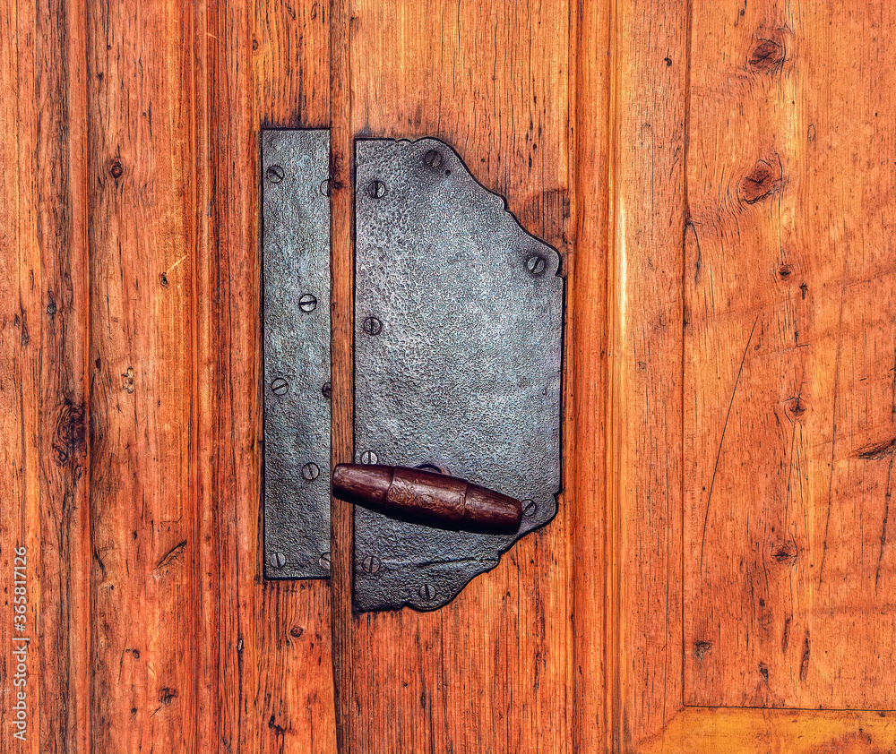 Old lock and handle on rustic wooden door. Natural texture of old ...