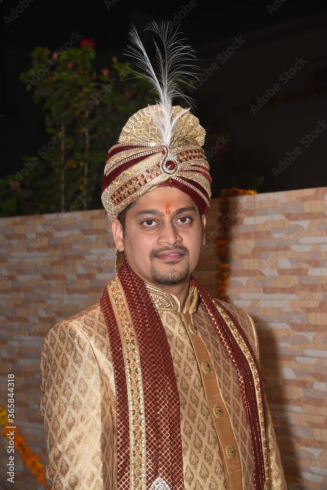 Indian Hindu Groom in traditional wedding dress posing for photograph ...