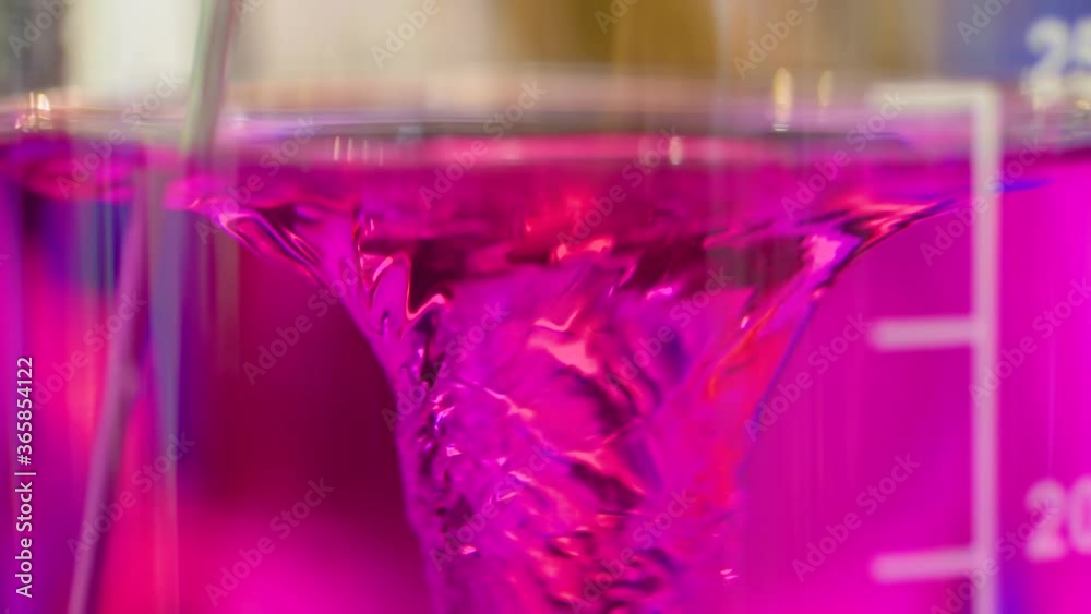 Vortex in magnetic mixer stirrer with fast moving stir bar for mixing ...