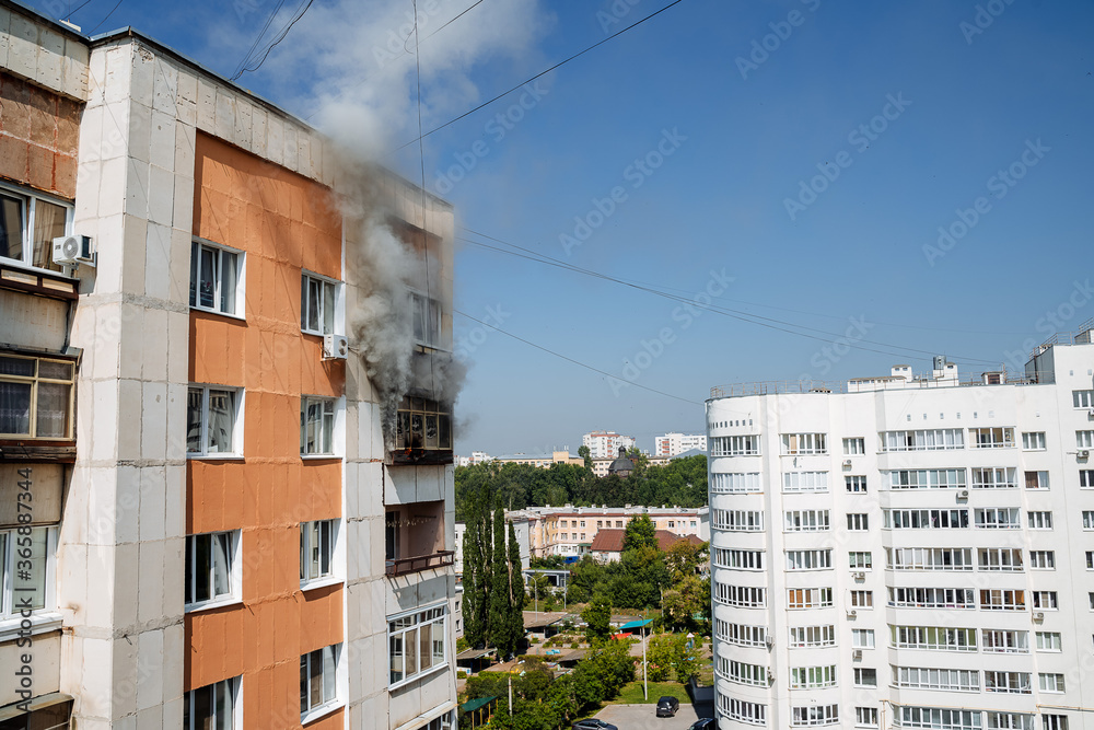 Fotografia do Stock: fire on the balcony of a multi-storey building ...