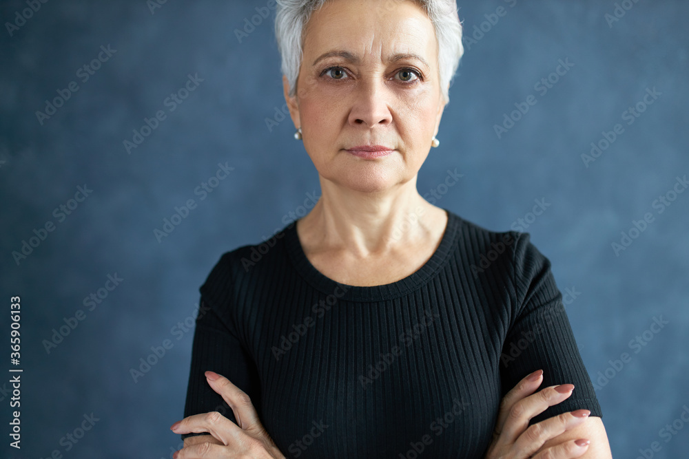 Cropped image of attractive middle aged European female with stylish ...