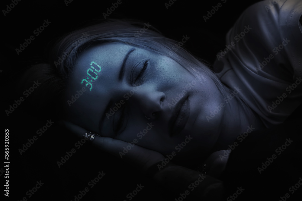 Sleeping woman with the time glowing on her forehead Stock Photo ...
