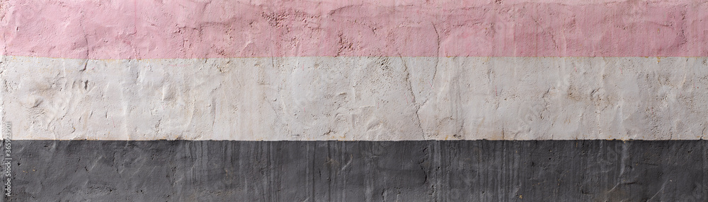 A concrete wall from a Bedouin settlement, painted in the colors of the ...