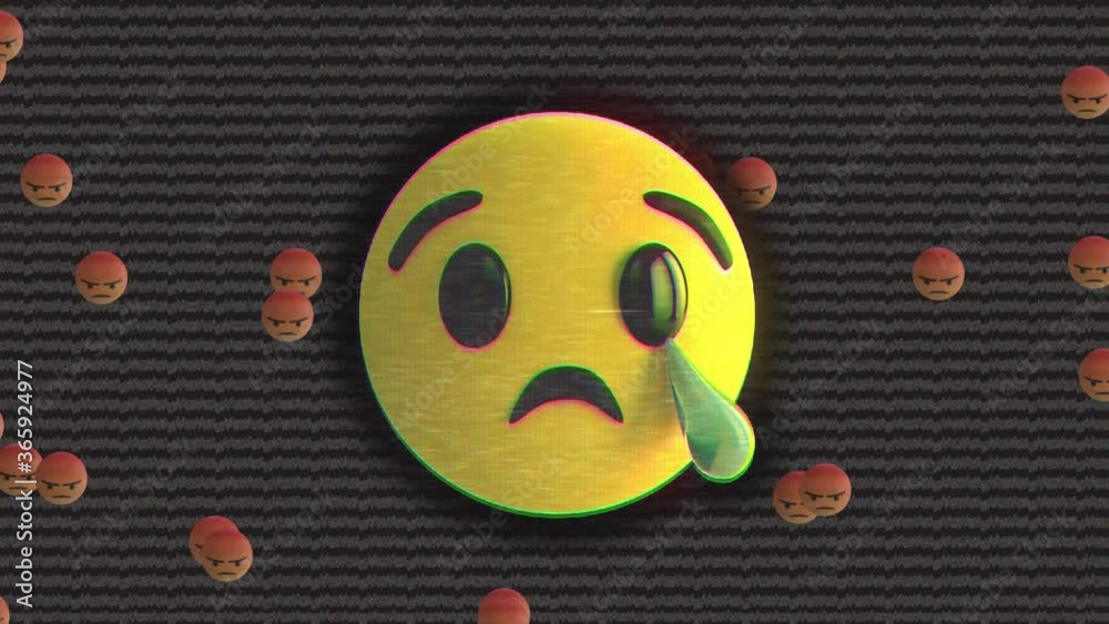 Crying face emoji against angry face emojis falling in background Stock ...