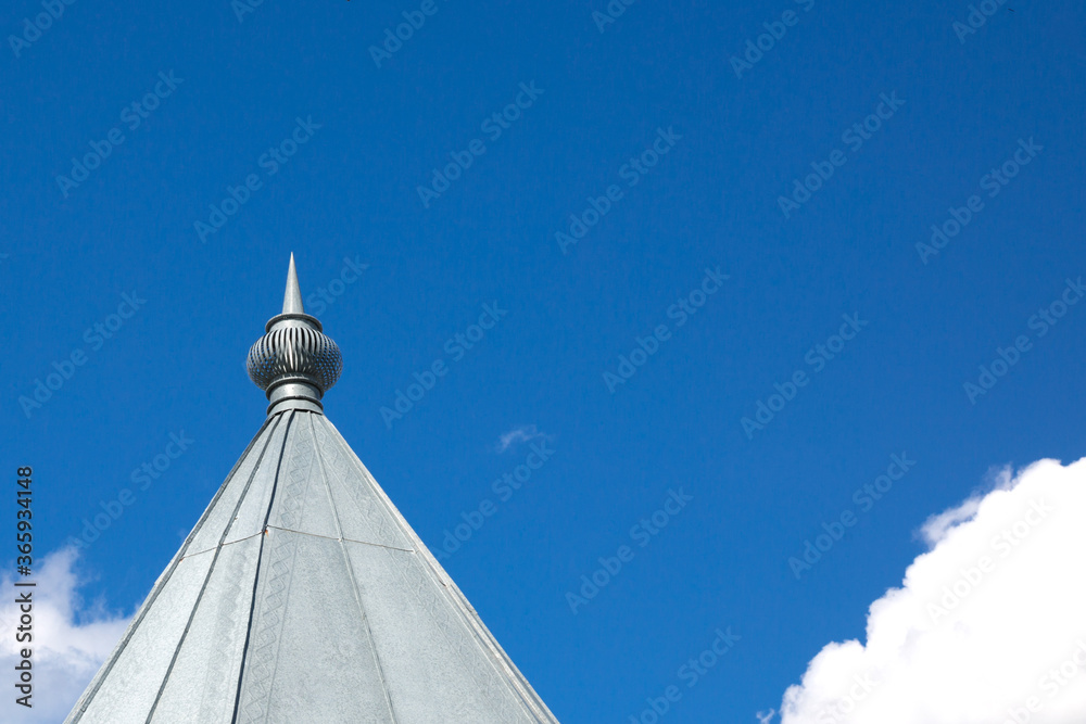 Dome of a muslim house against a background of blue sky and clouds ...