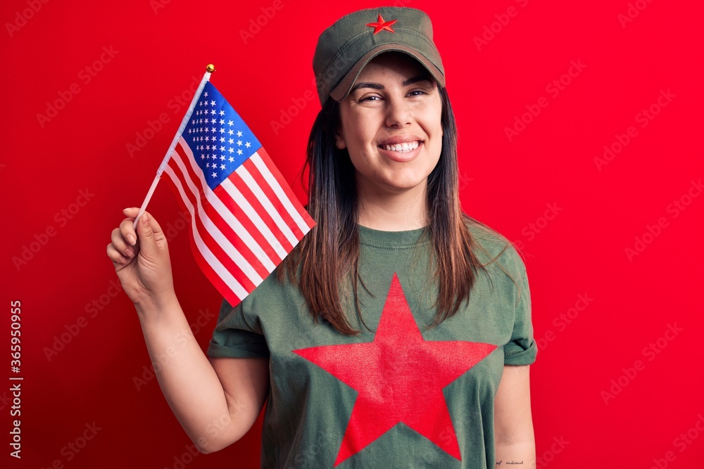 Beautiful woman wearing t-shirt with red star communist symbol holding ...
