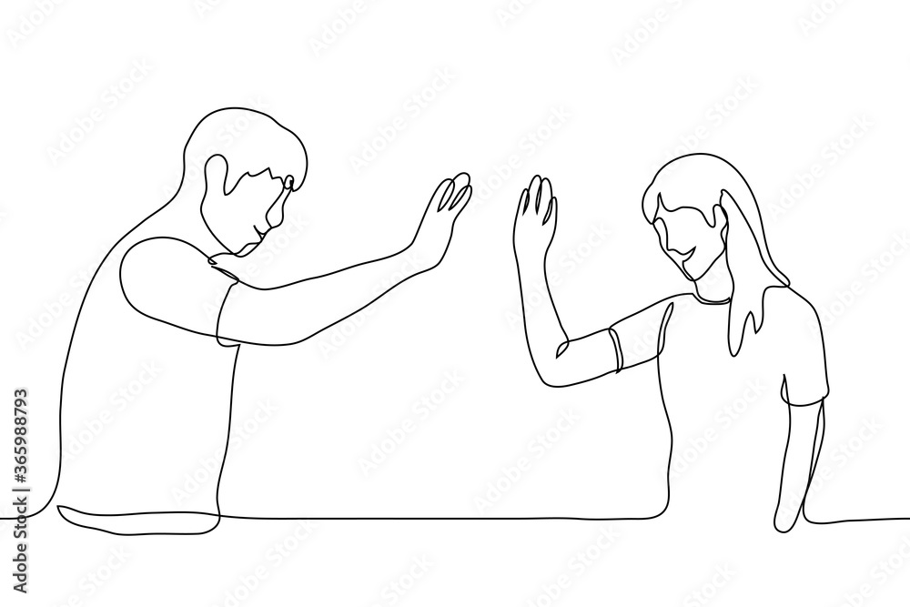 The young guy smiles and gives five to the girl who smiles back at him ...