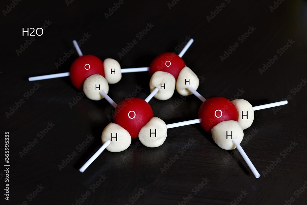 Red and White Ball and stick 3D model of the water molecule H2O on a ...