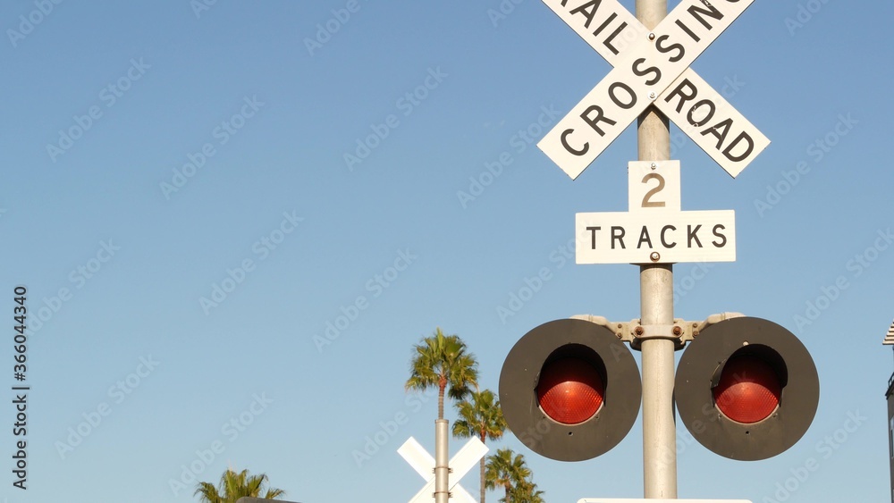 Level crossing warning signal in USA. Crossbuck notice and red traffic ...