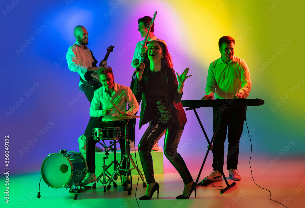 Motion. Young caucasian inspired and expressive musicians, band ...