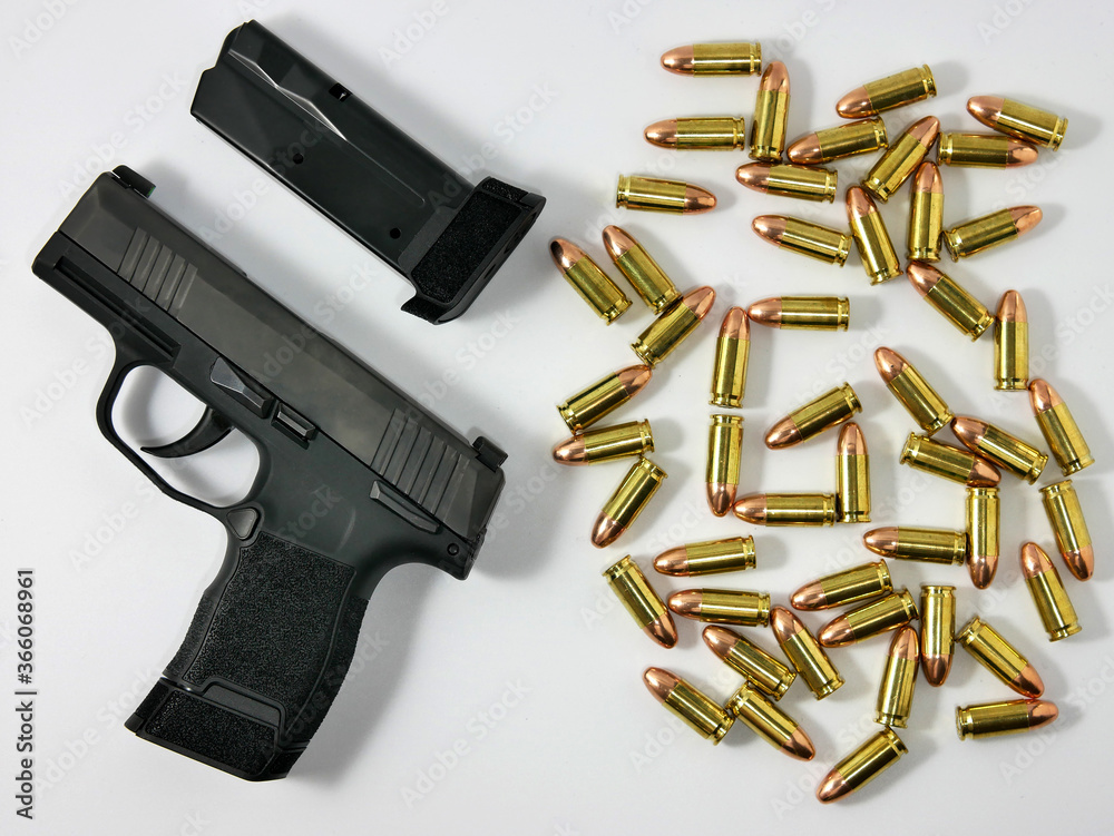 Short guns and ammunition placed on white background.Guns and ...