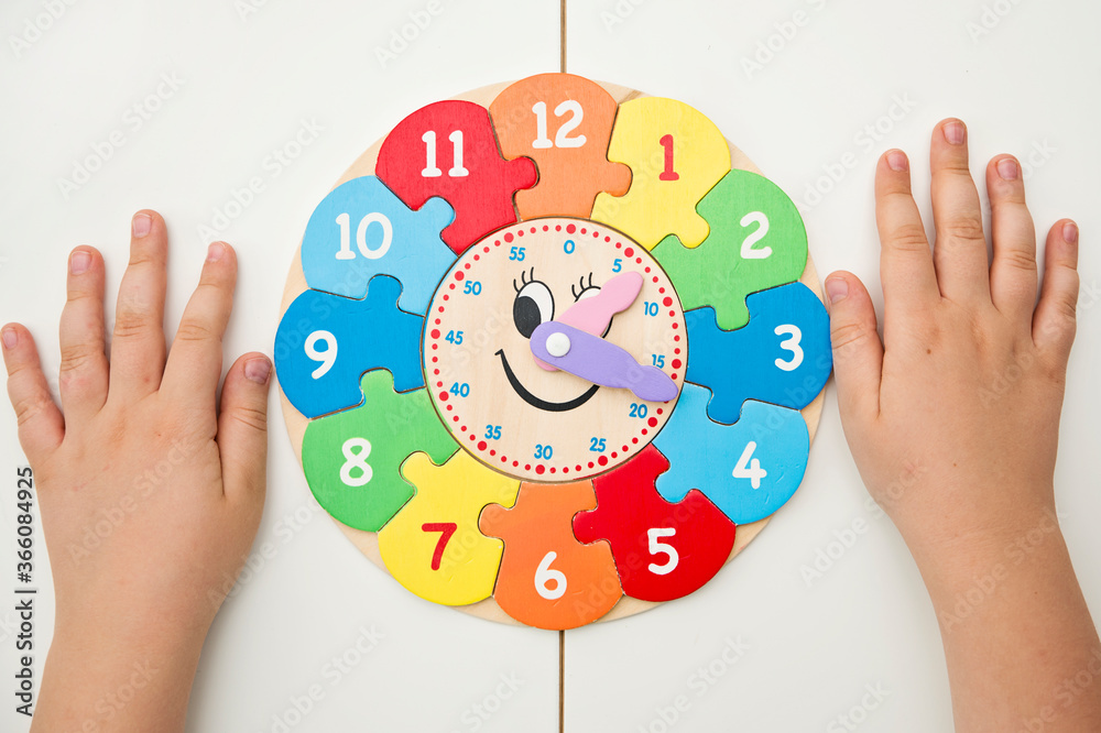 Boy learning time with wooden clock. Toy for Learning method for ...
