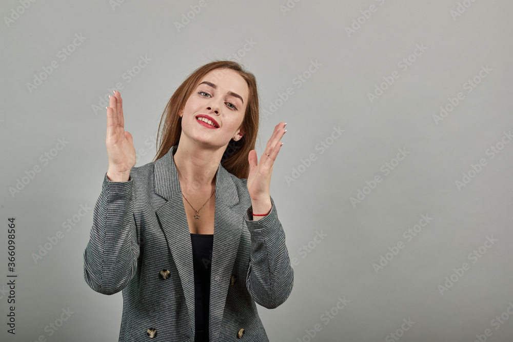 Shapes big object with two hands, gasps from surprise, holding palms in ...