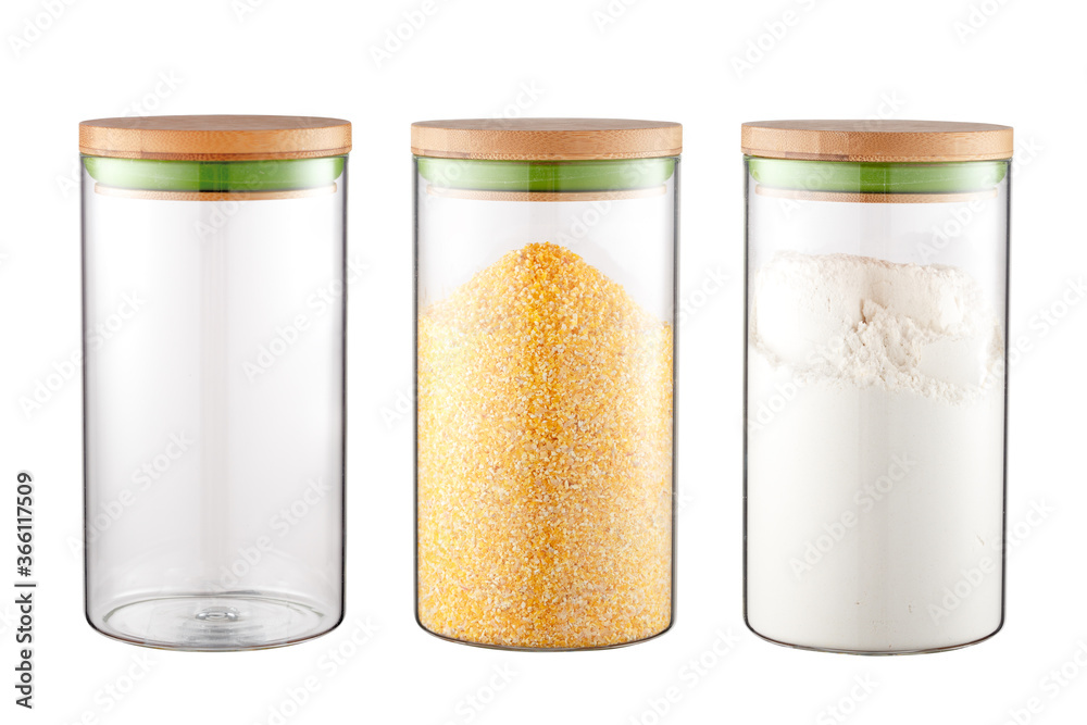 Corn grits and flour in a transparent glass container. The set of items ...